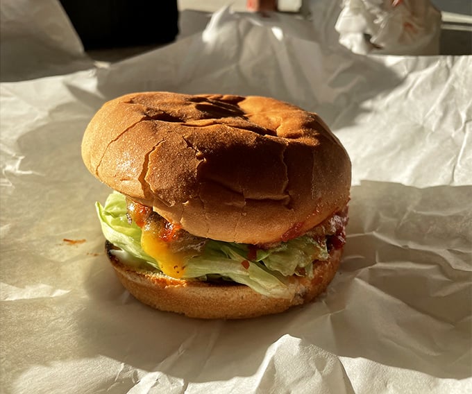 The legendary Hickoryburger arrives wrapped in paper like a present – unwrap to discover the perfect ratio of beef, sauce, lettuce, and bun that's converted thousands to the cause.
