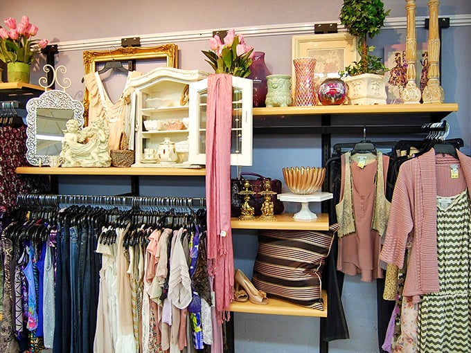 Where shabby meets chic. Pink scarves cascade next to delicate china cabinets, creating a boutique feel that belies the thrift store prices.
