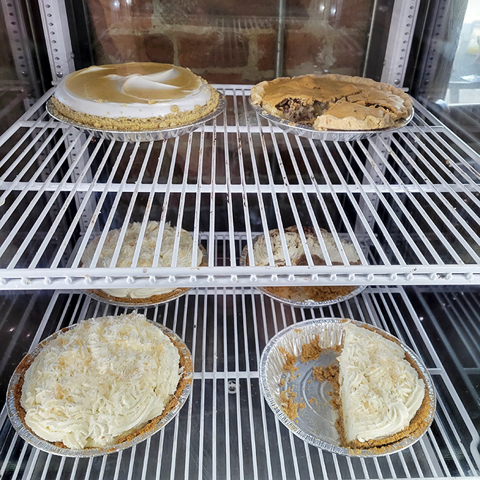Pie display that would make your grandmother both proud and jealous. Cream pies waiting patiently for their moment in the spotlight.