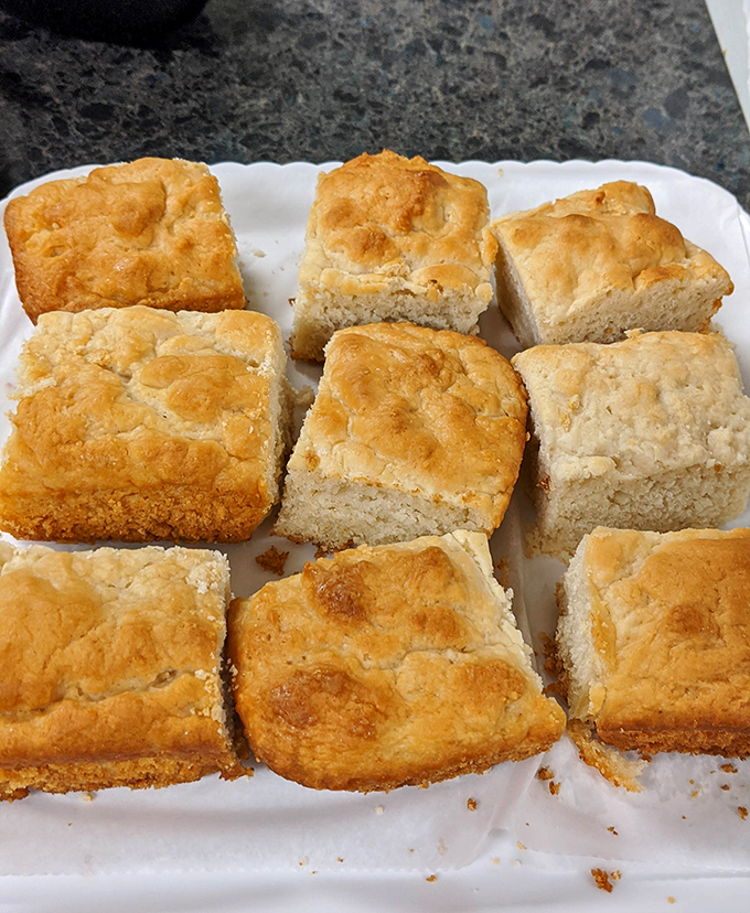 These aren't just biscuits; they're golden-topped time machines transporting you back to Sunday mornings when calories didn't count and butter was a food group.