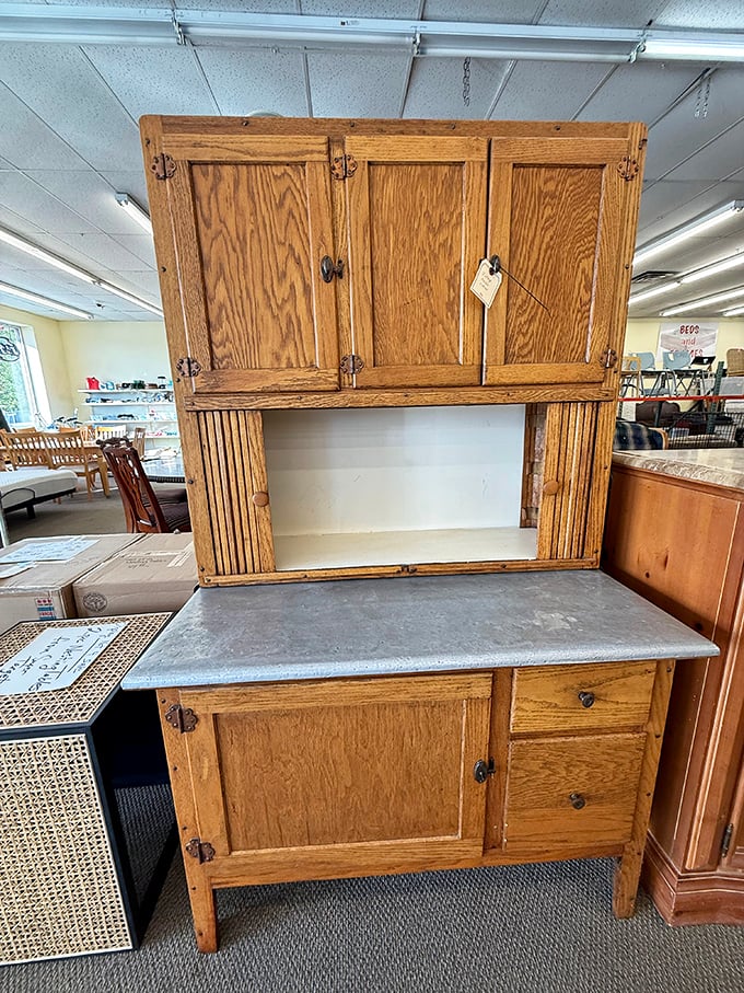 Not just a Hoosier cabinet – it's a portal to grandma's kitchen, complete with flour-dusted memories and the ghosts of Sunday dinners past.