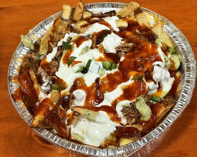 The "Hot Mess" lives up to its name gloriously—fries, pulled pork, cheese sauce, and zero regrets. Diet starts tomorrow.