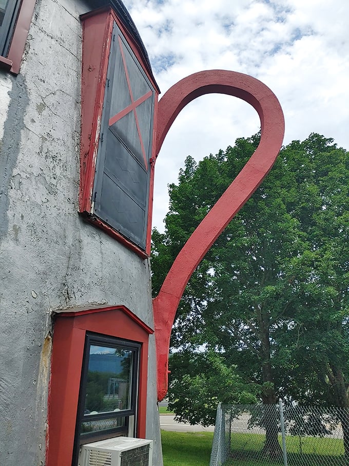 The dramatic curve of the handle creates a striking silhouette against the sky—proof that sometimes the best roadside attractions are equal parts art and oddity.