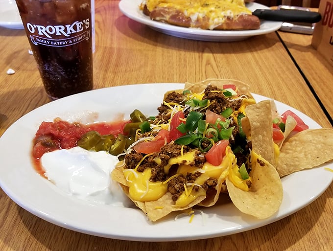 Nachos get the Irish treatment with homemade kettle chips smothered in savory meat, cheese, and fresh toppings – a cultural mashup that absolutely works.