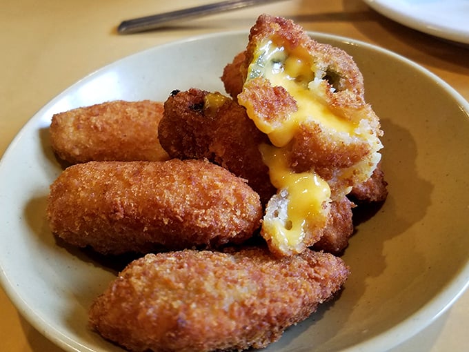 These aren't just jalapeño poppers—they're little golden treasure chests with molten cheese hearts waiting to be discovered.