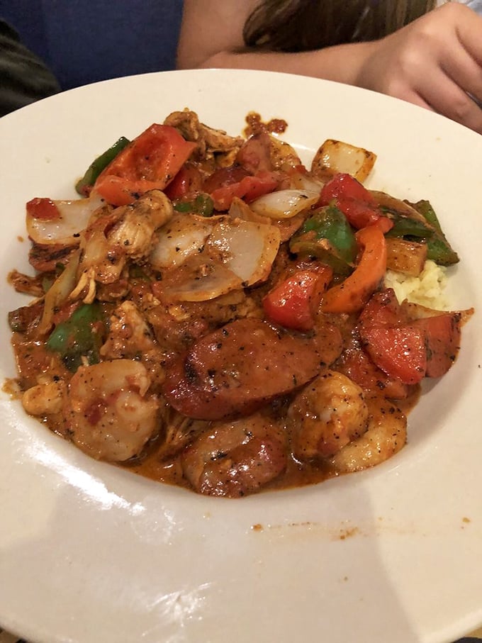 A jambalaya that doesn't just mix seafood and sausage – it hosts a spicy neighborhood block party where everyone gets along beautifully.