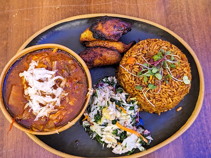 This Jollof rice plate is the comfort food you never knew you needed – rich, aromatic, and topped with enough sides to keep your fork dancing.