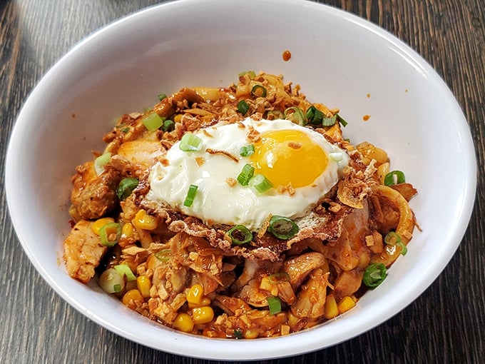 Spicy, savory, and crowned with a perfect egg—this bowl is what happens when kimchi meets comfort food. The vibrant colors promise a flavor explosion.