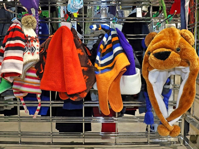 Winter hats with personality hang like colorful fruit. That tiger hat isn't just warm – it's a conversation starter that works in any language.