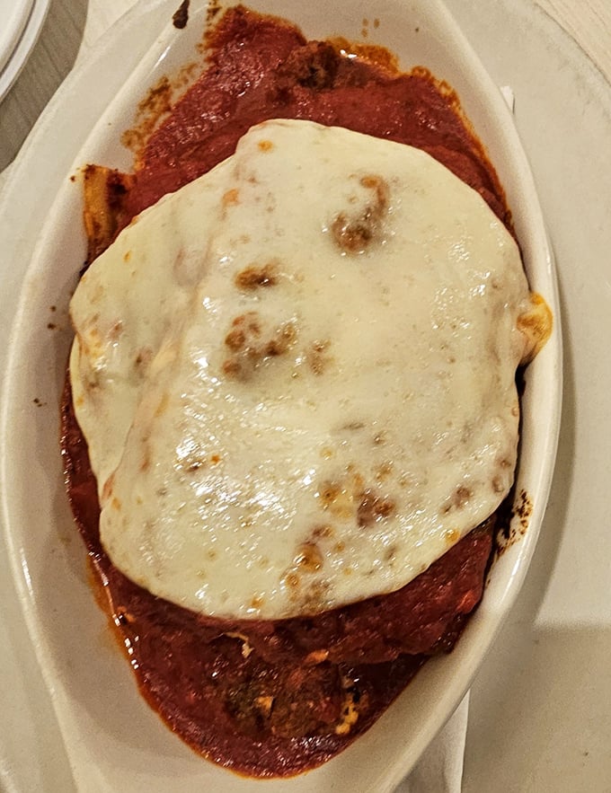 Lasagna that doesn't just sit on the plate—it lounges, confident in its cheese-pulling, sauce-dripping magnificence.