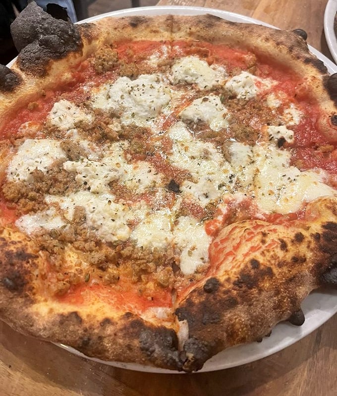 Behold the lasagna pizza that doesn't just have cheese on top—it has attitude. Those char marks aren't accidents; they're flavor badges of honor.