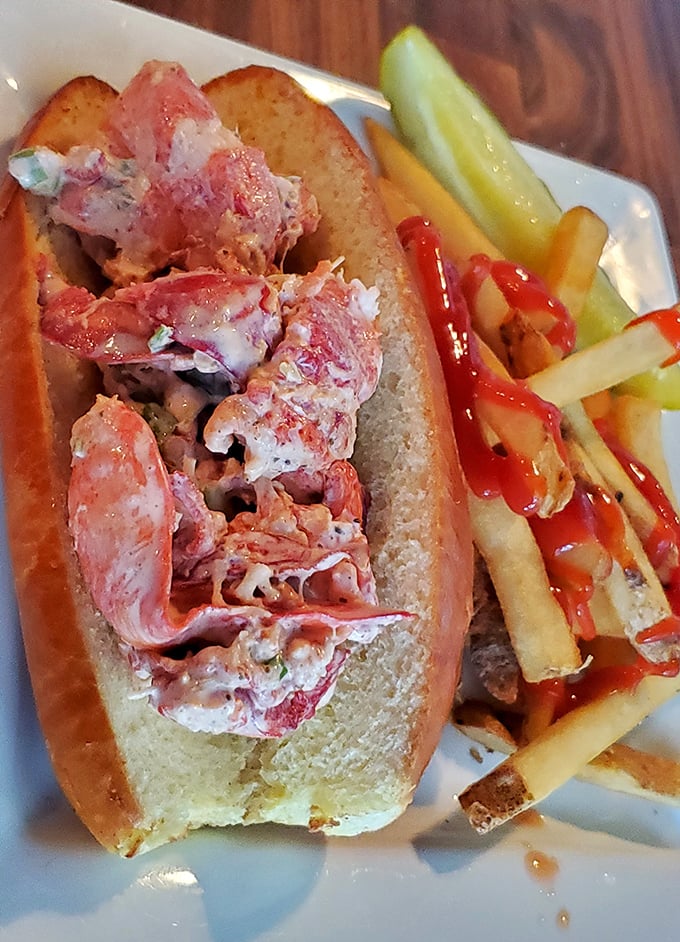 The lobster roll—summer vacation in sandwich form. Those chunks of lobster meat aren't just generous; they're practically showing off.