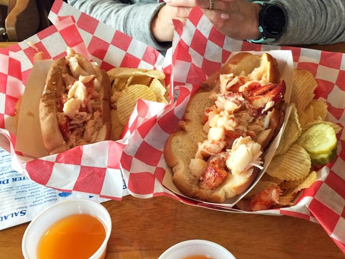 Lobster rolls served simply in red checkered paper boats—because when the star ingredient is this good, you don't need fancy presentation to make hearts flutter.