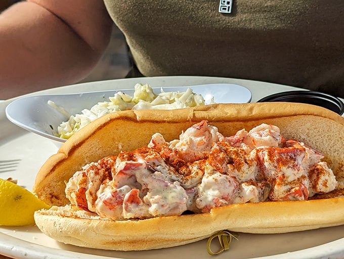 Lobster roll perfection: chunks of sweet meat barely contained by a toasted bun – like ocean treasure presented on a breadcrumb pedestal.