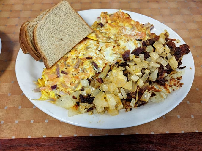 This hearty breakfast platter doesn't just feed your hunger—it adopts it, raises it, and sends it to college.