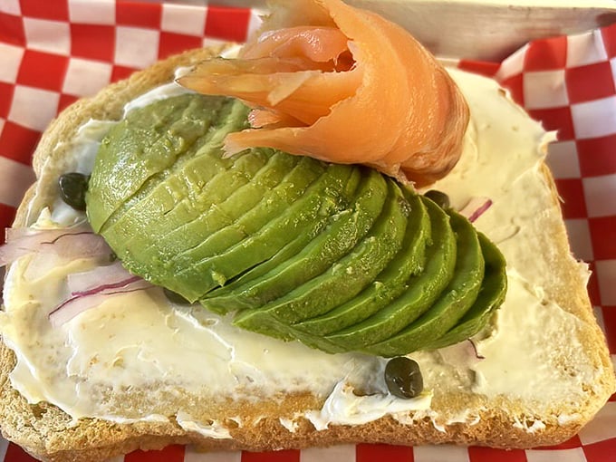 Avocado toast elevated to art form – creamy green perfection topped with lox that would make any New York deli nod in respectful approval.