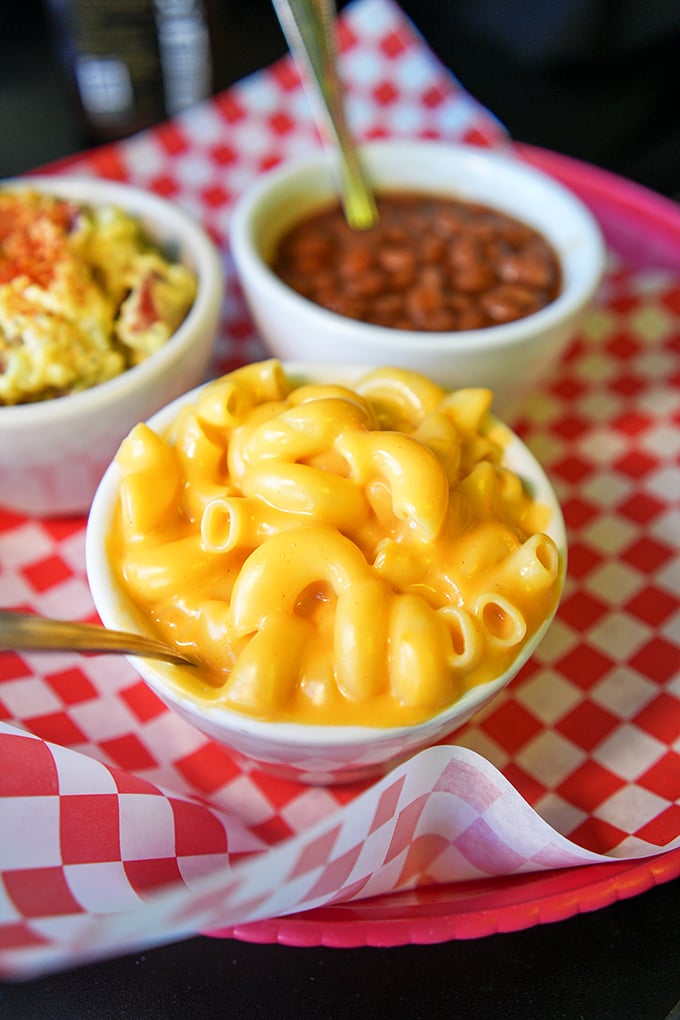 Mac and cheese that achieves that perfect golden hue. This isn't the blue box stuff from your childhood—this is the grown-up version of your comfort food dreams.