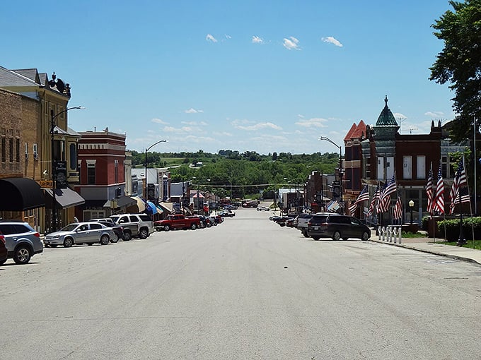 Main Street slopes gently downward, revealing the rolling countryside beyond—a daily reminder that nature is never far in Corning.