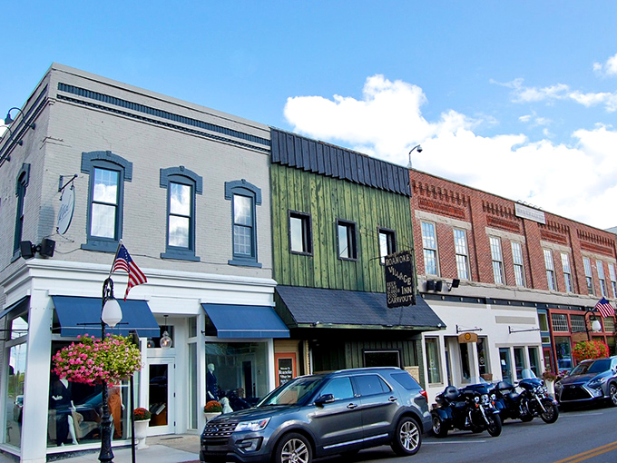 Architectural character on full display, with each storefront adding its own verse to Roanoke's visual poetry of brick, awnings, and American flags.