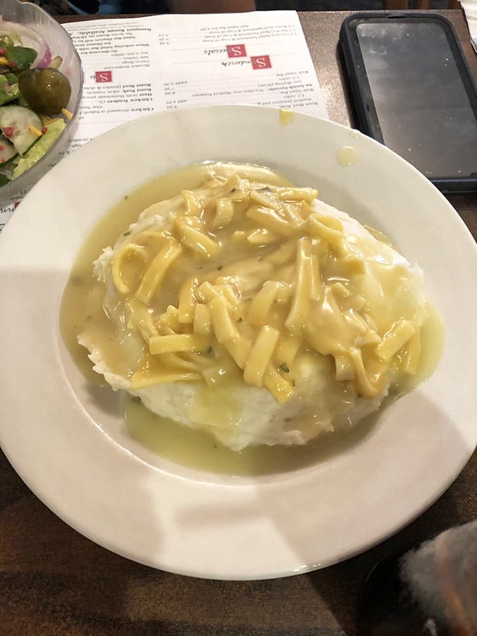 Chicken and noodles over mashed potatoes—because sometimes one carb simply isn't enough to achieve true Midwestern bliss.