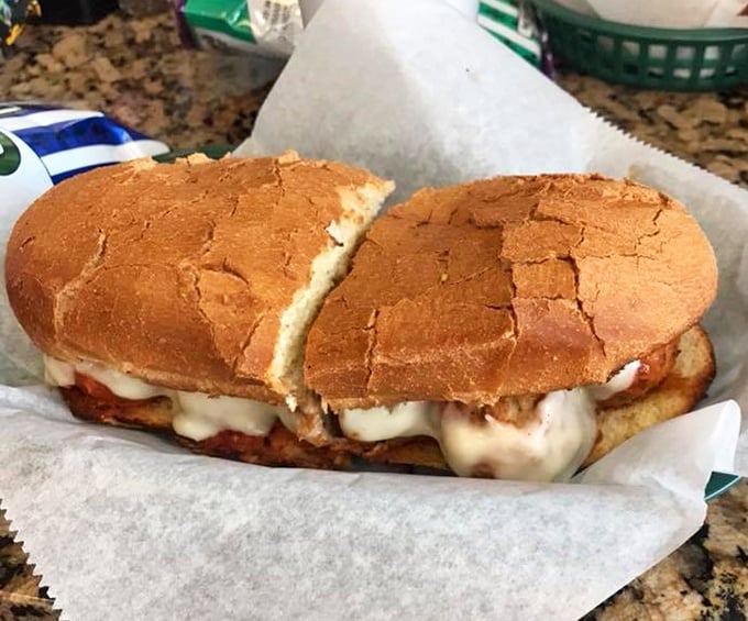 The humble meatball sub elevated to art form—where marinara-soaked bread cradles perfectly seasoned spheres of meaty goodness under a blanket of molten cheese.