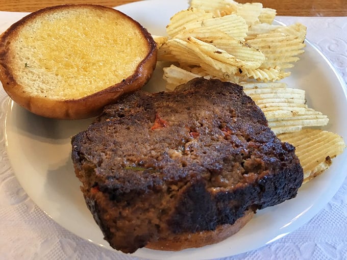 The meatloaf doesn't need fancy garnishes—it stands confidently beside Texas toast like the reliable friend who always shows up when you need comfort.