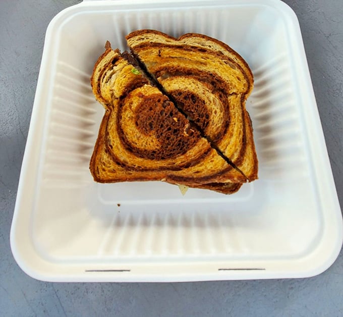 The marbled rye swirl isn't just for show—it's the perfect canvas for what might be the most photogenic grilled cheese in Central Oregon.