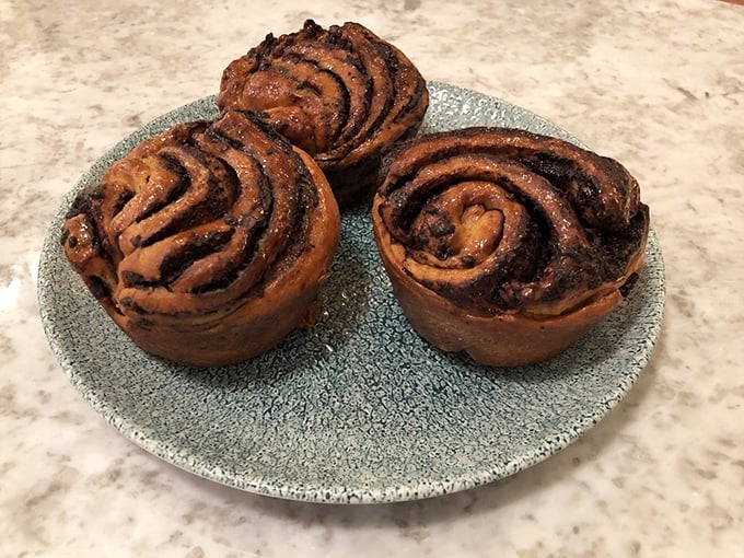 These chocolate babkas aren't just pastries, they're edible architecture – swirls of chocolate nestled in golden dough that shatters beautifully with each bite.