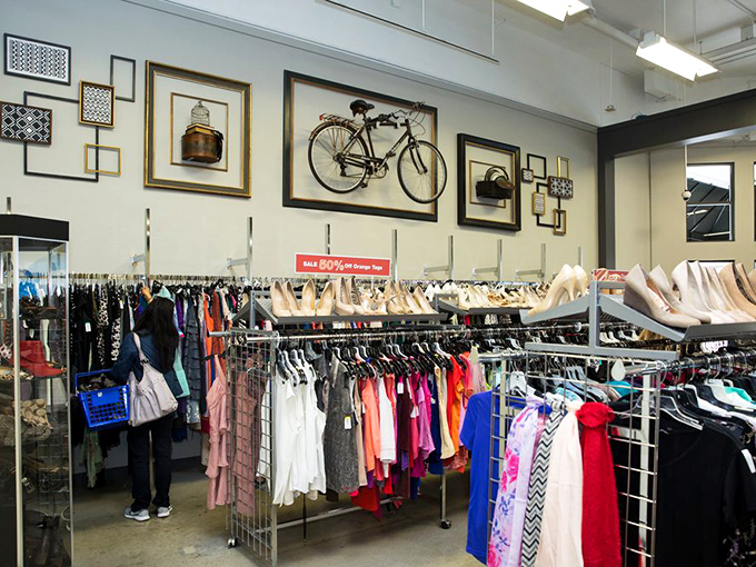 Beneath inspirational wall messages, shoppers hunt for that perfect piece—the one that makes you say, "I can't believe someone gave this away!"