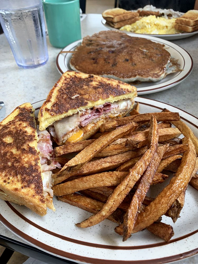 The Monte Cristo sandwich and hand-cut fries—proof that sometimes the best things in life are, in fact, deep-fried to golden perfection.