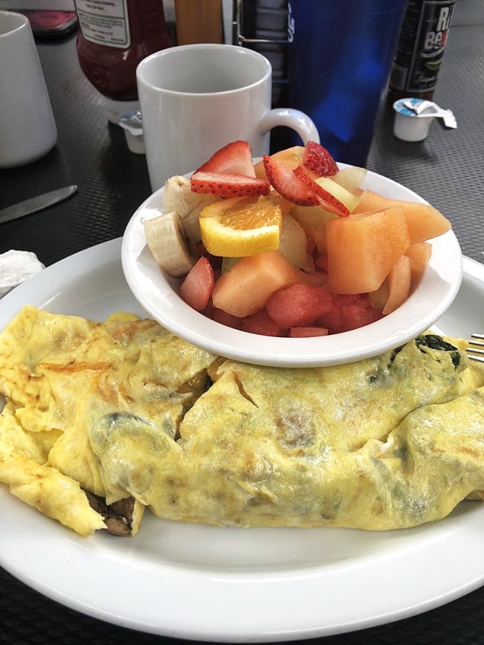 An omelet that knows its purpose in life: to deliver maximum flavor while providing a perfect excuse to order a side of fresh fruit.