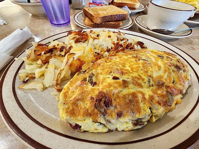 The perfect omelet doesn't exi— Oh wait, there it is, golden and puffy, lounging next to hash browns that have achieved the ideal crisp-to-tender ratio.