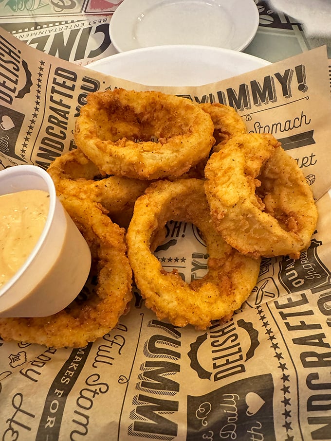 Golden halos of onion, fried to perfection—these rings aren't just appetizers, they're crunchy bracelets of joy that disappear all too quickly.