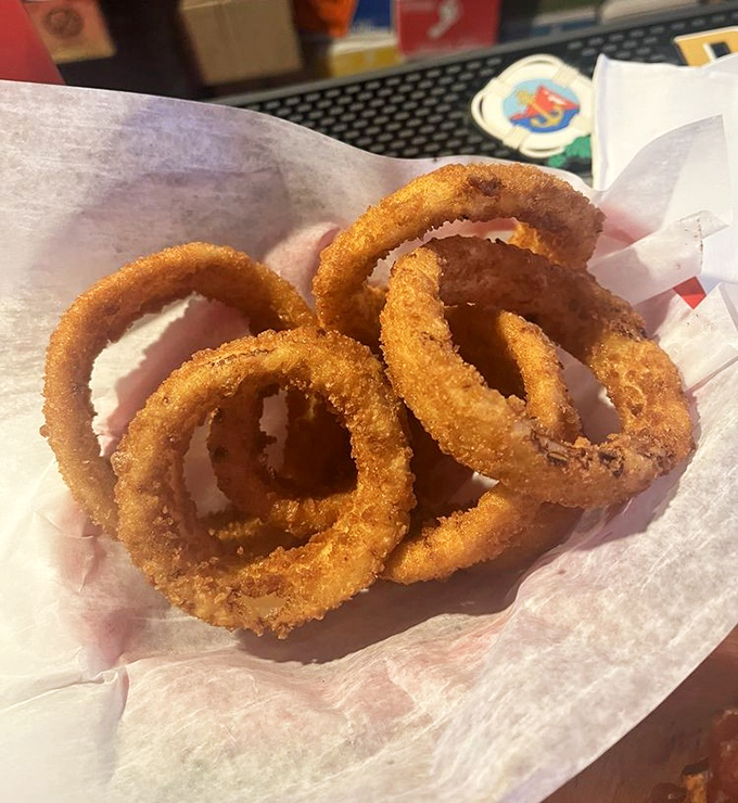 Onion rings with the perfect crunch-to-tenderness ratio – golden halos that make you wonder why anyone bothers with lesser versions.
