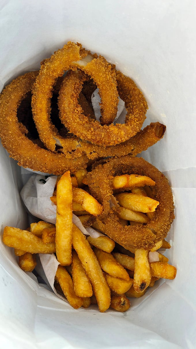 Crispy onion rings and golden fries - the supporting actors that sometimes steal the show from the burger headliners.