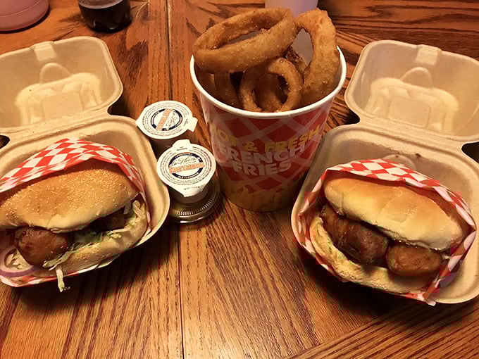 The holy trinity of American fast food: burgers, onion rings, and fries. This basket contains more joy than most people experience in an entire workweek. 