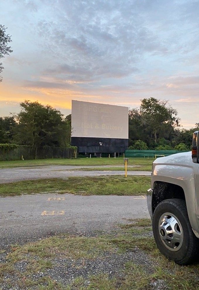 Dawn breaks over the iconic white screen, standing like a monument to simpler pleasures in our complicated world.