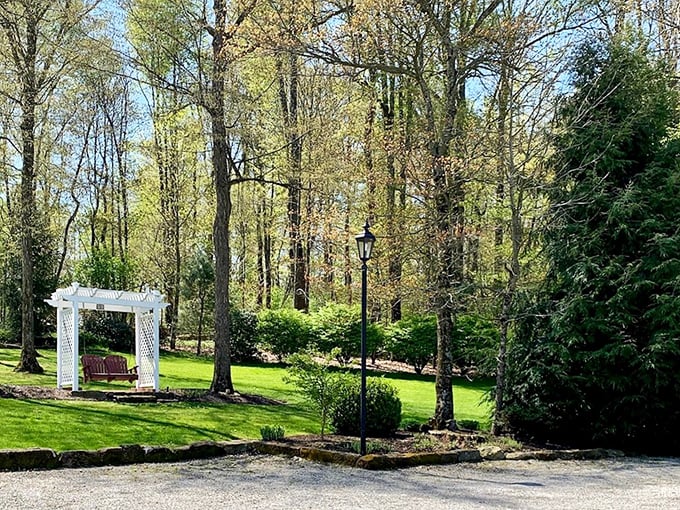 A garden arbor invites contemplation among spring blooms. Here's where you realize your backyard "oasis" back home is just a sad patio with delusions of grandeur.