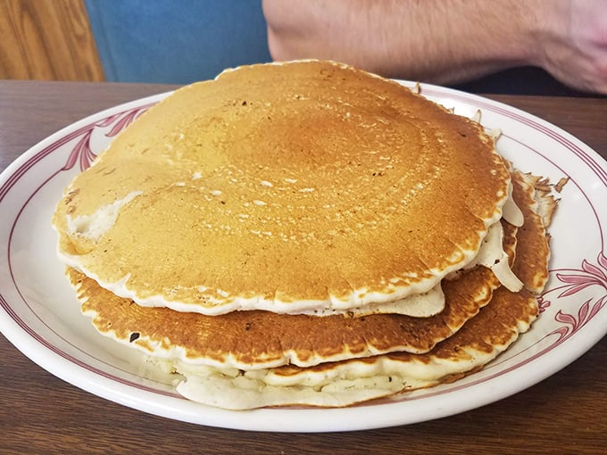 Pancakes so perfectly golden they belong in Fort Knox. The kind that make you wonder why anyone bothers with fancy brunch.