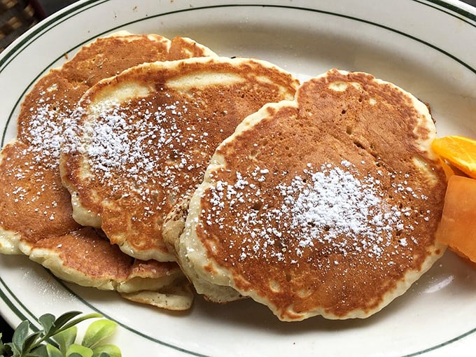 Pancakes dusted with powdered sugar that somehow manage to be both fluffy and substantial. Breakfast nirvana achieved.