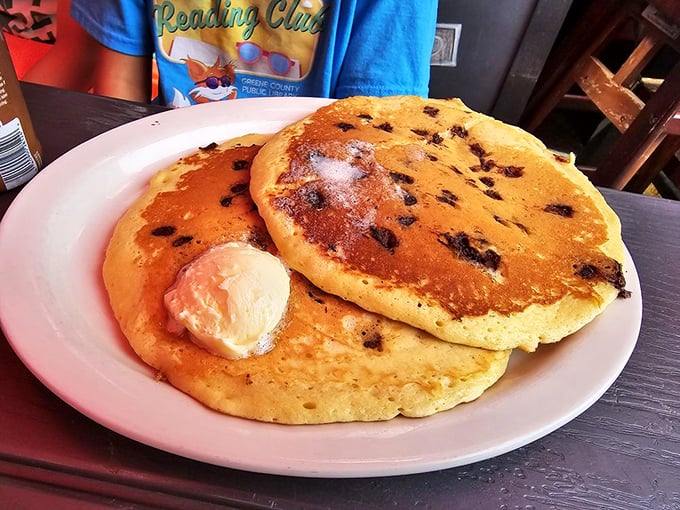 Chocolate chip pancakes that make you understand why people wait in line on Sunday mornings—fluffy islands in a sea of potential maple syrup.