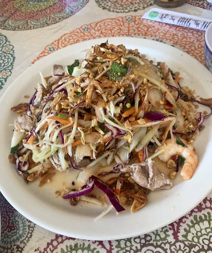 This papaya salad doesn't mess around – a crunchy, tangy celebration that makes your taste buds feel like they're at Mardi Gras.