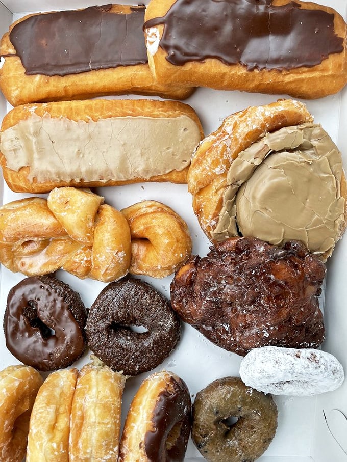 The donut box assortment: a family reunion of fried dough relatives, each with their own personality but all equally welcome at your breakfast table.