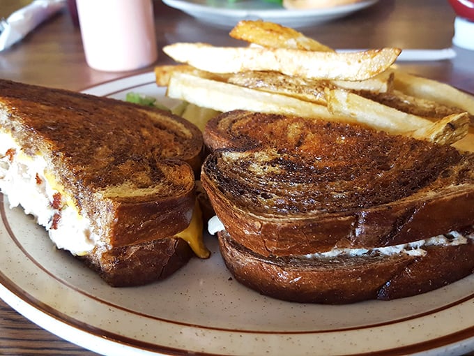 The patty melt—where bread meets beef in a marriage officiated by melted cheese. A sandwich that demands both hands and your full attention.