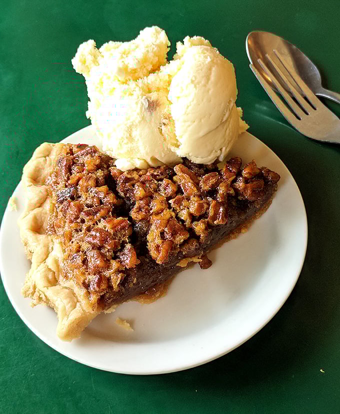 Pecan pie that strikes the perfect balance between gooey and crunchy, sweet and nutty. That scoop of vanilla ice cream isn't optional—it's completing a sacred ritual.