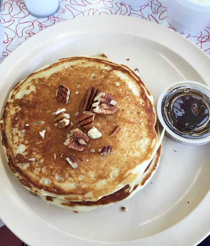 Pecan pancakes that look like they were made by someone who truly understands the meaning of breakfast. Those nuts aren't decoration—they're commitment.