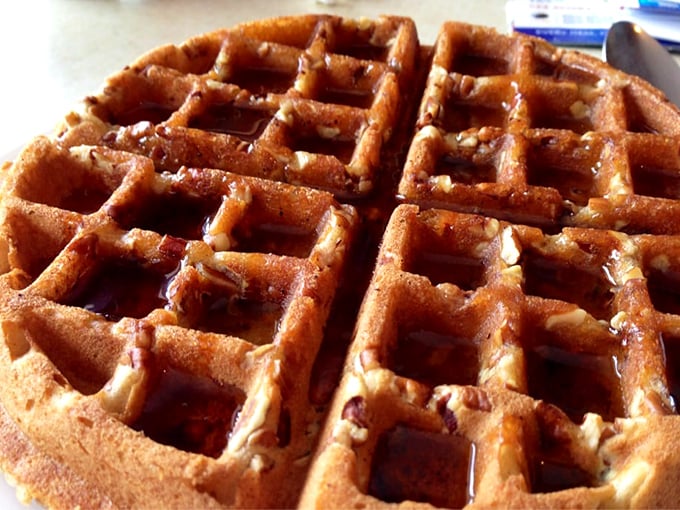 The pecan waffle—a geometric wonder with perfect squares designed by breakfast engineers to hold maximum syrup in every delicious pocket. 