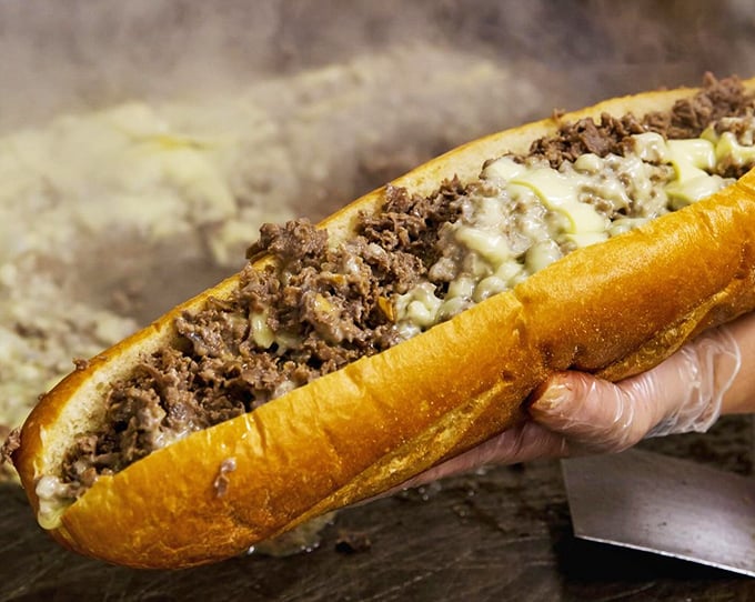 Behold the cheesesteak in its natural glory – tender meat, melted cheese, and bread that somehow remains sturdy despite the delicious onslaught.