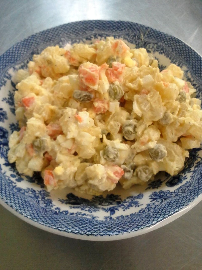Polish potato salad that puts American picnic versions to shame. Those little peas and carrots aren't just colorful – they're plotting to make you ask for seconds.