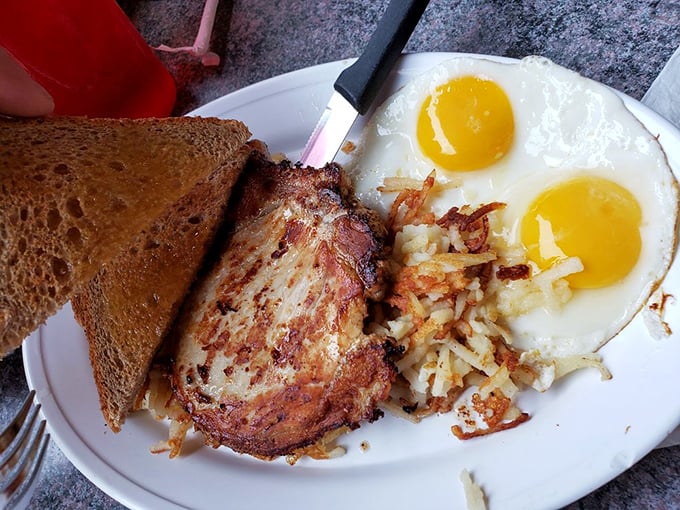 Pork chop, eggs, and hash browns – the holy trinity of breakfast that's converted more food sinners than any religion ever could.